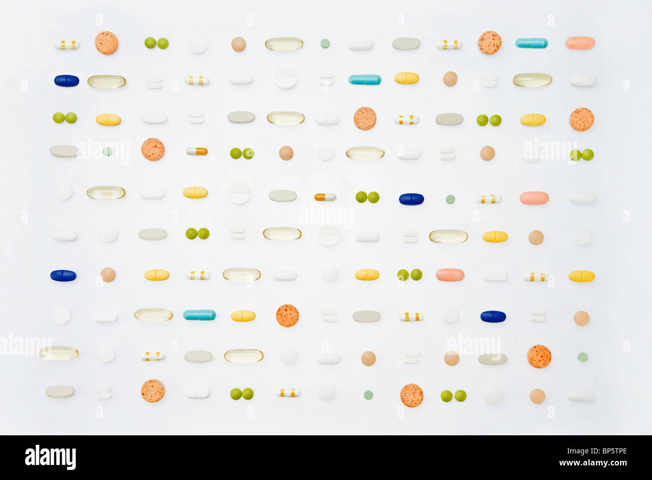 Rows of pills on white background Stock Photo - Alamy