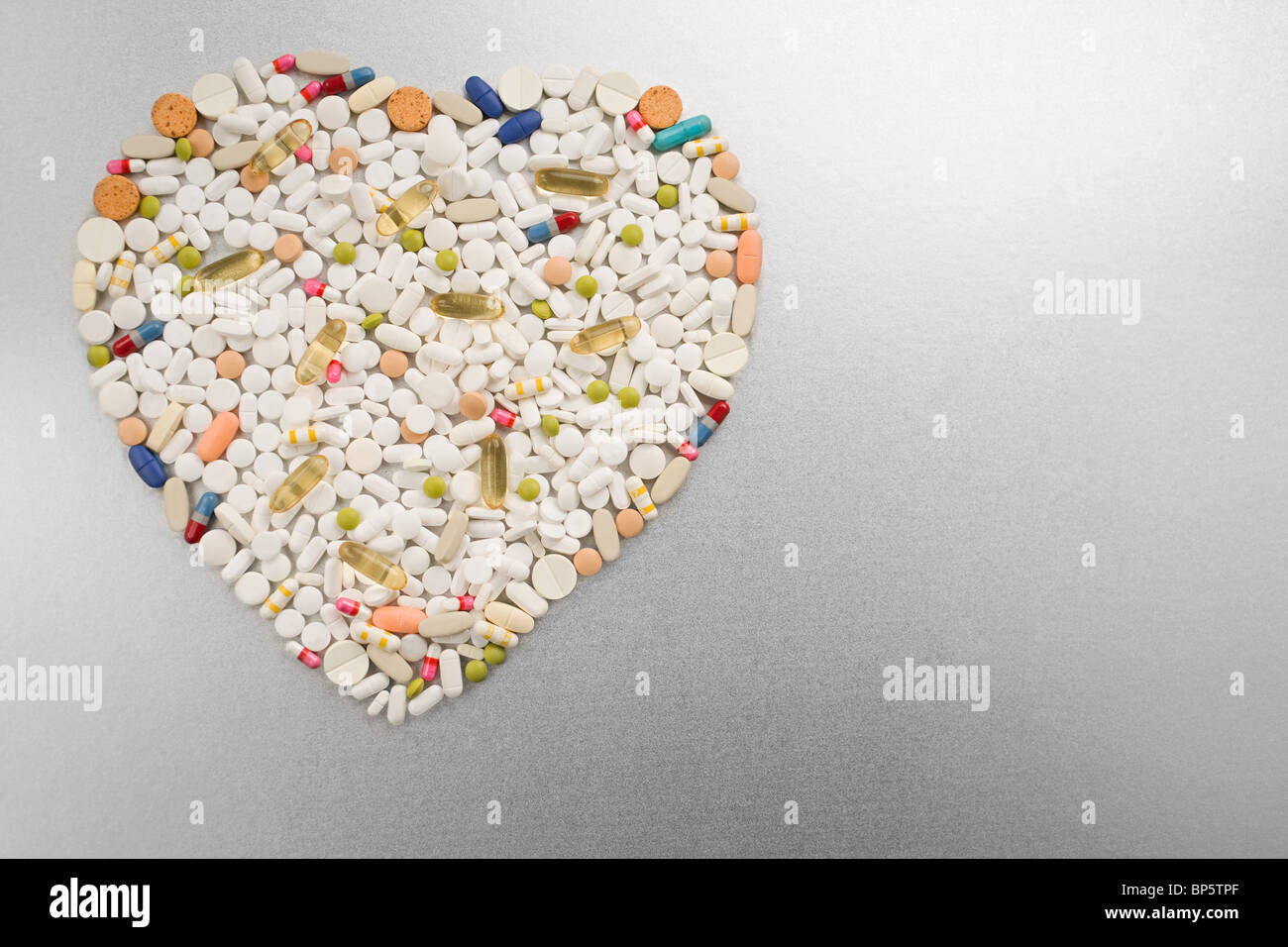 Heart shape made from pills Stock Photo - Alamy