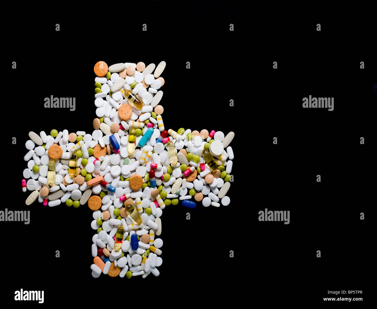 Cross made from pills Stock Photo - Alamy
