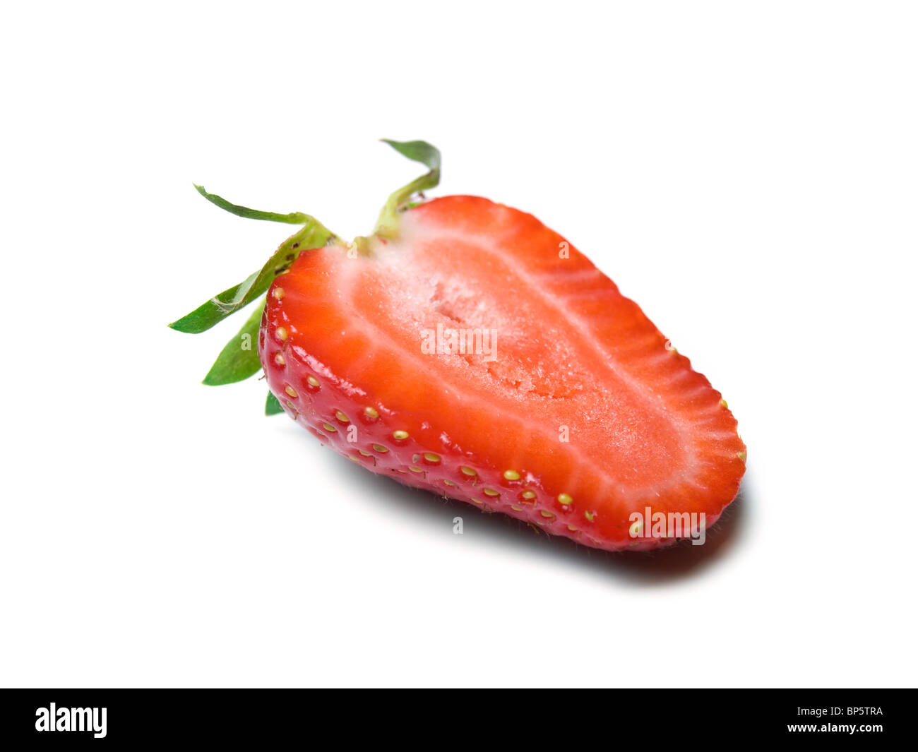 Half of ripe strawberry on a white background Stock Photo - Alamy
