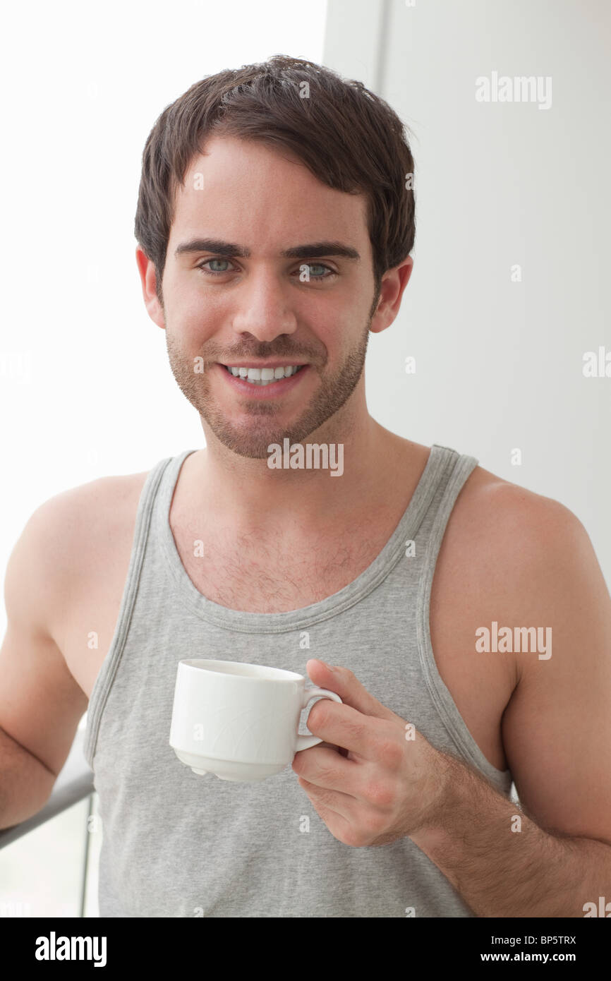 Young man with coffee Stock Photo - Alamy