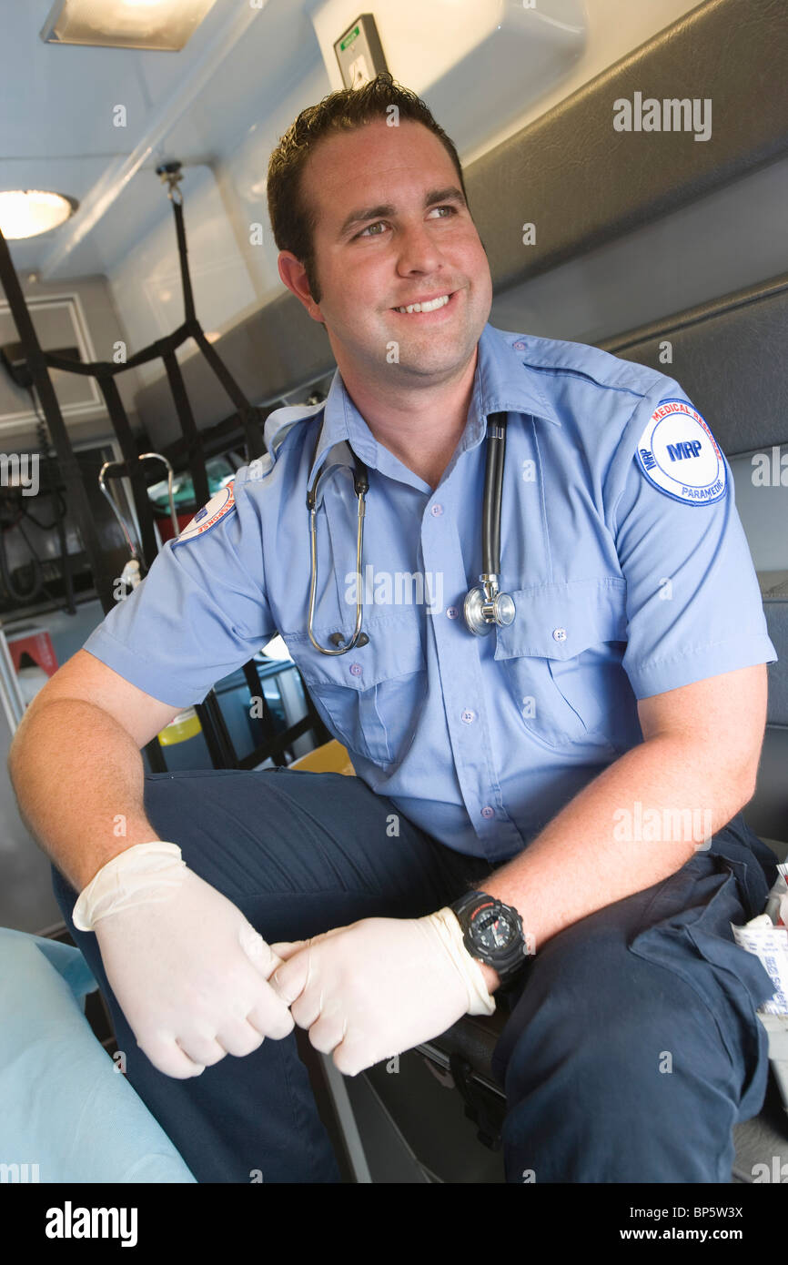Paramedic in ambulance Stock Photo - Alamy