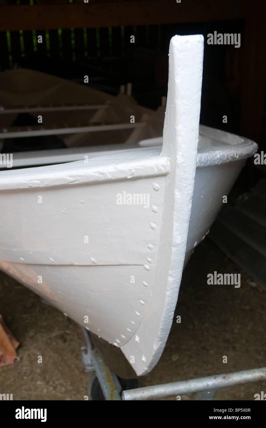 Traditionally built Norwegian wooden rowing boat, painted white. Inside ...
