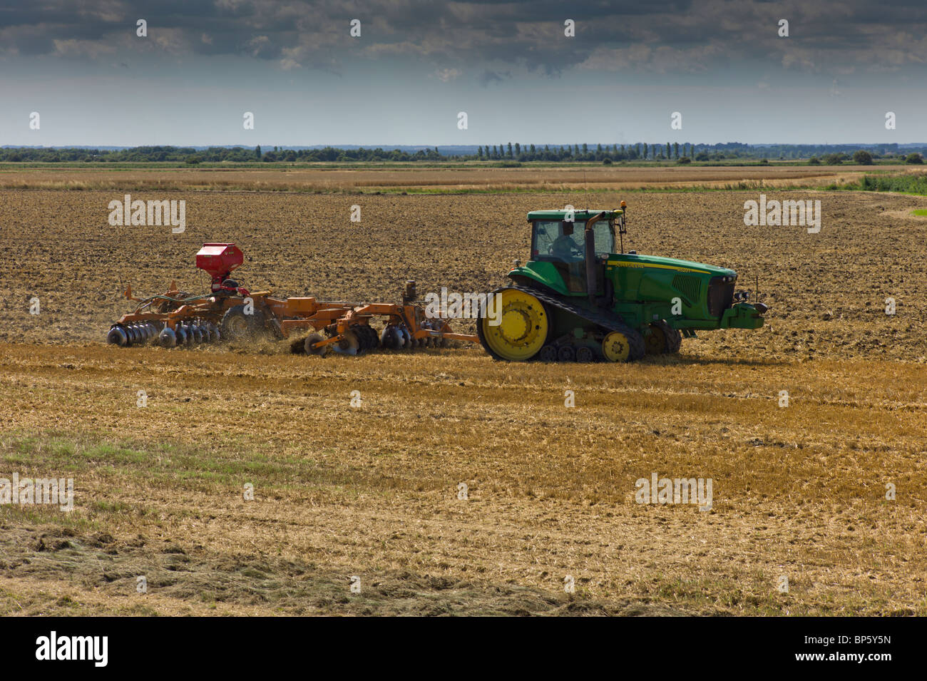 Tractor Ploughing newly mown field in kent Stock Photo - Alamy