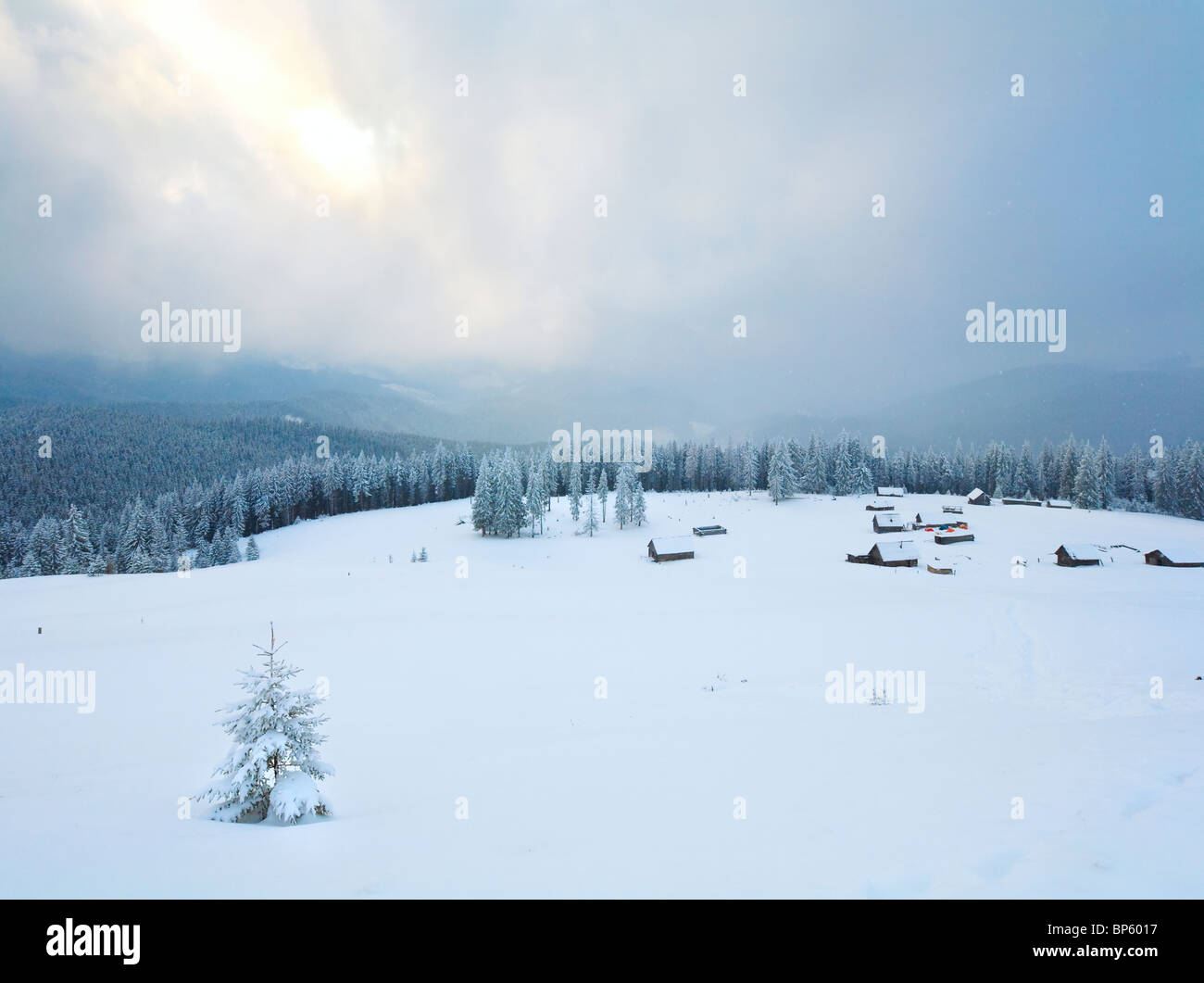 winter dull mountain landscape with sheds group (Kukol Mount ...