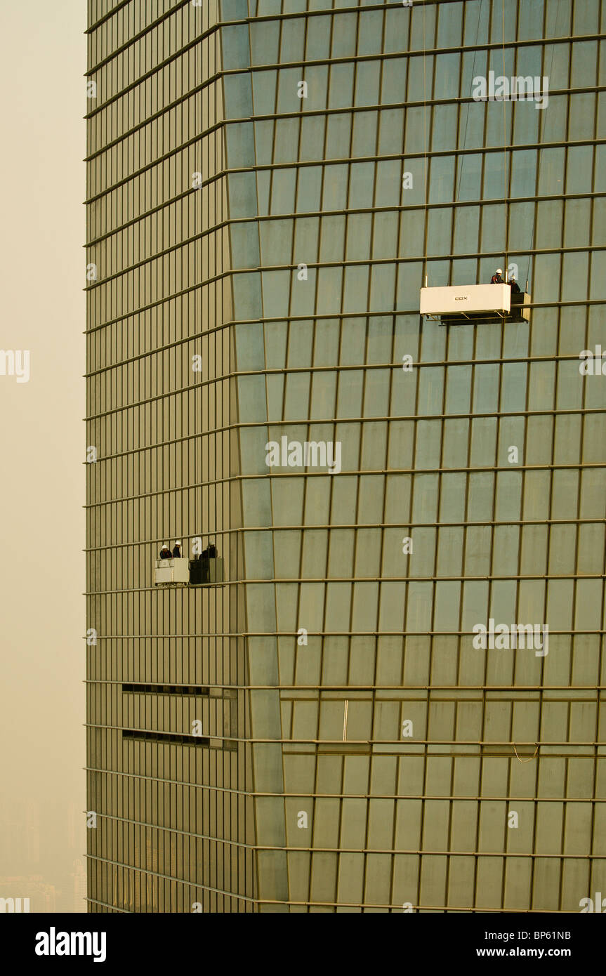 China, Shanghai. Window cleaners on the Shanghai World Financial Center ...