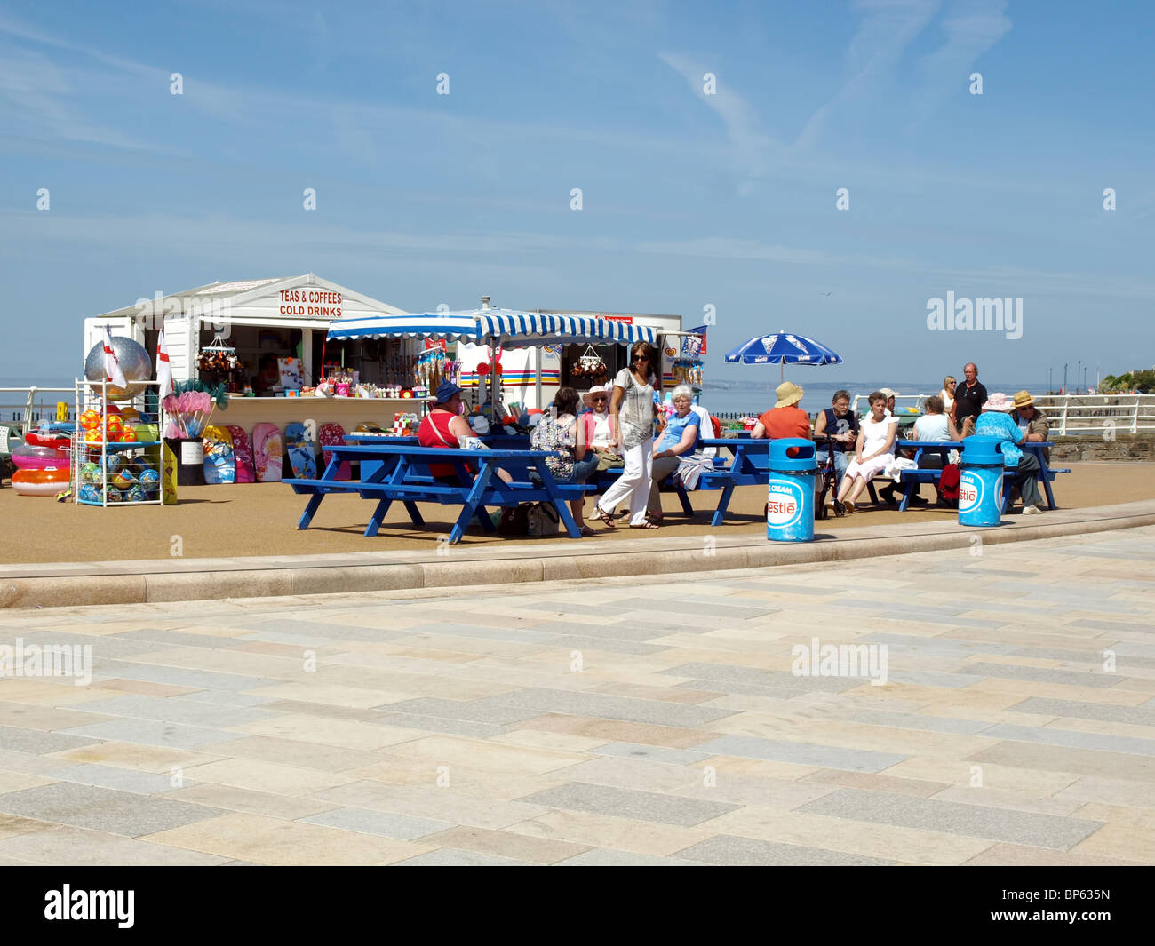 A colorful beach cafe and kiosk on the promenade at Weston-Super-Mare ...