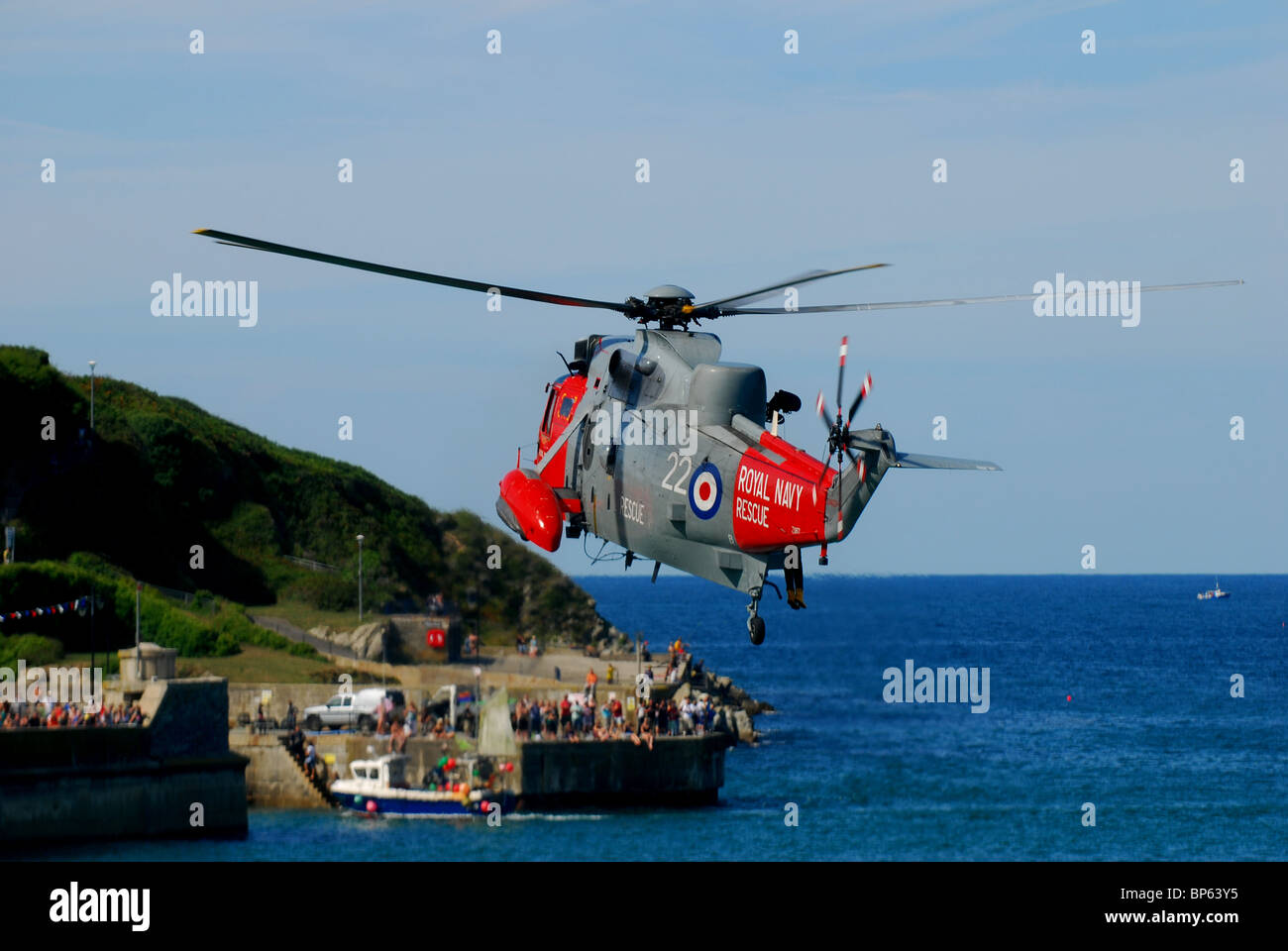 Royal Navy rescue helicopter flying over sea (Newquay harbour Stock ...