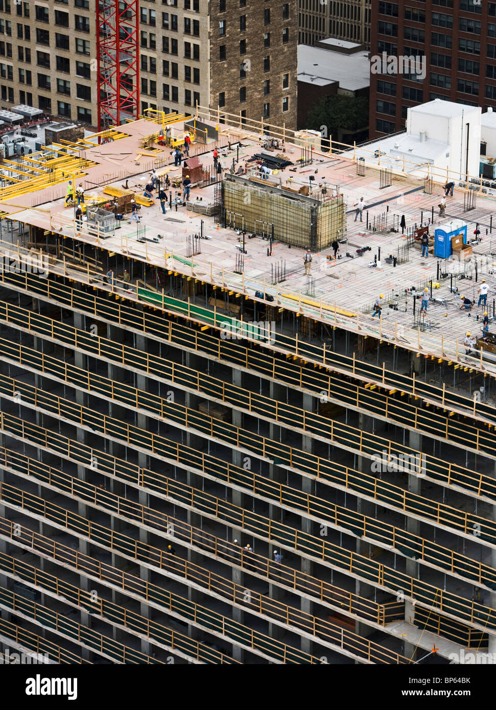 A skyscaper being built with workers on top. Abstract Stock Photo - Alamy