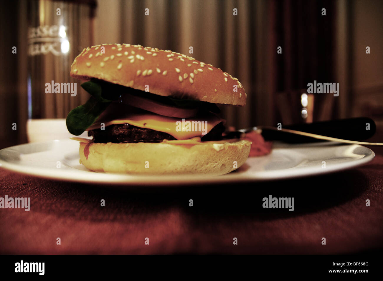 A hamburger, expression of junk food Stock Photo - Alamy