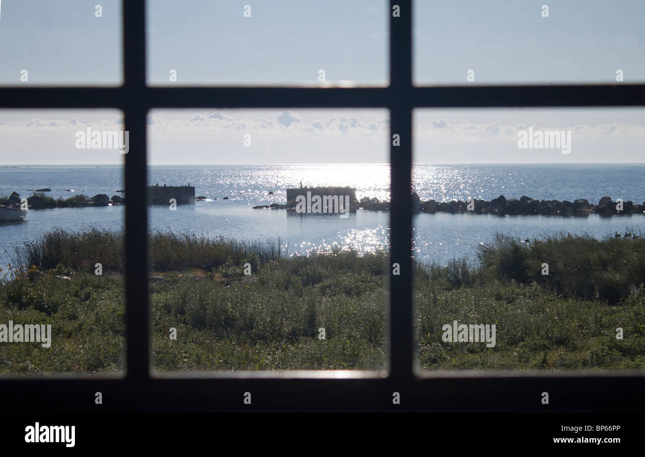 Sunrise over the sea through a pane glass window Stock Photo - Alamy