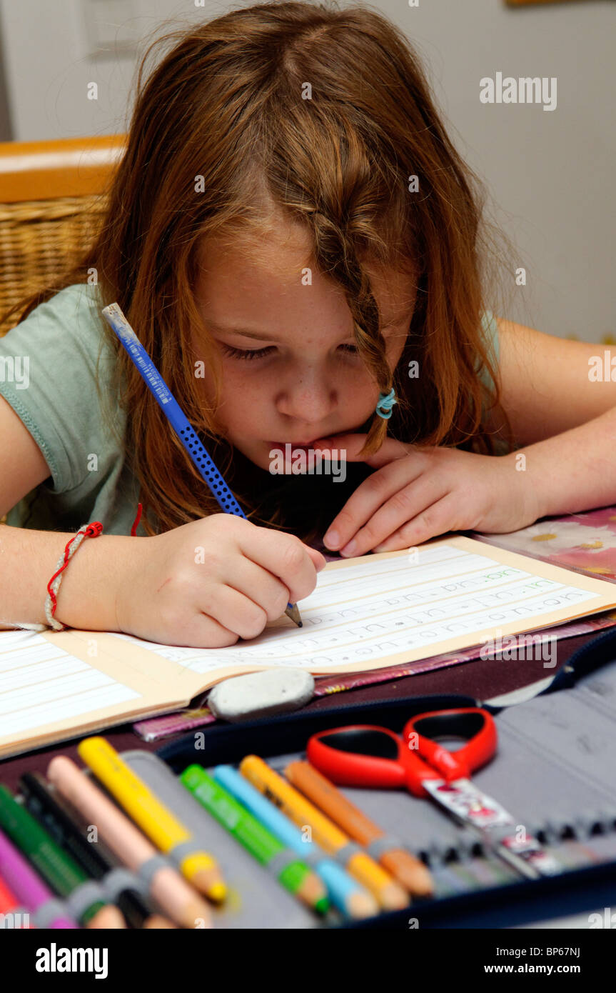 young girl doing her homework Stock Photo - Alamy