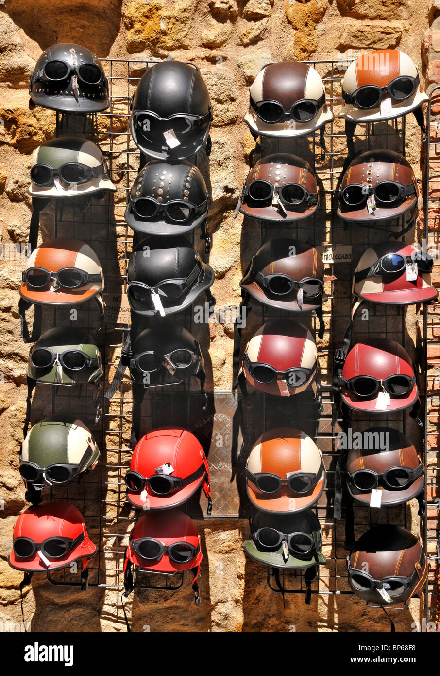A selection of motorbike helmets on display for sale Stock Photo - Alamy
