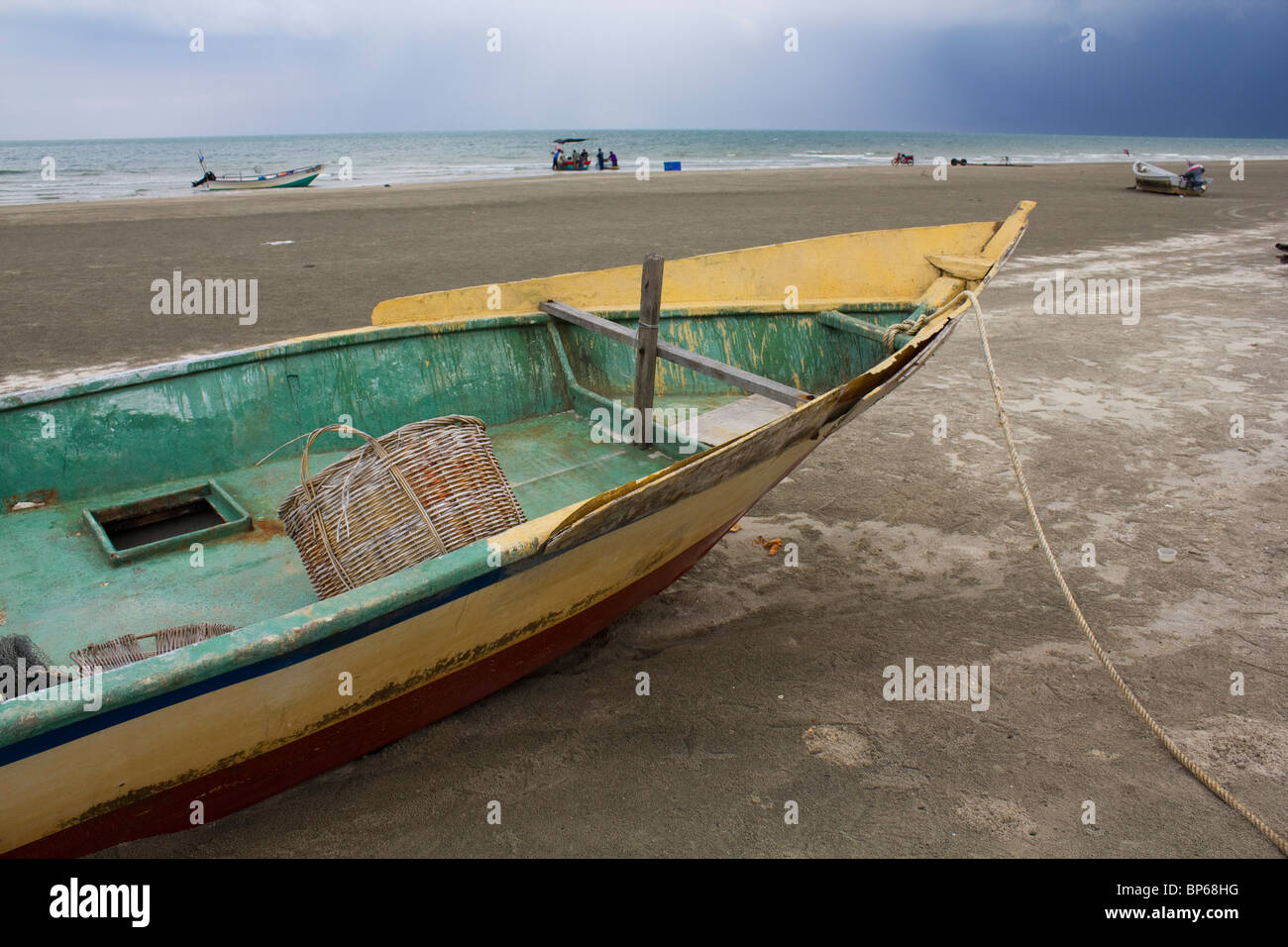 Fishing boat on the beach at Beserah, Kuantan, as a storm front ...