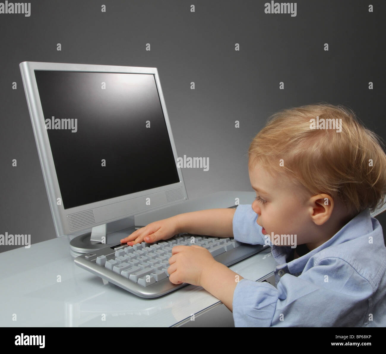 Jordan, Ontario, Canada; A Toddler Typing At A Computer Stock Photo - Alamy