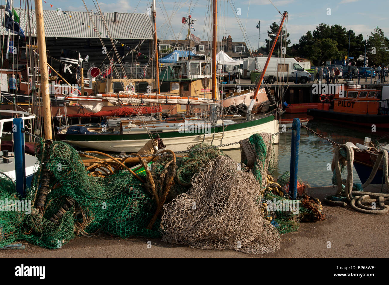 traditional oyster yawls smacks and fishing nets in Whitstable harbour ...