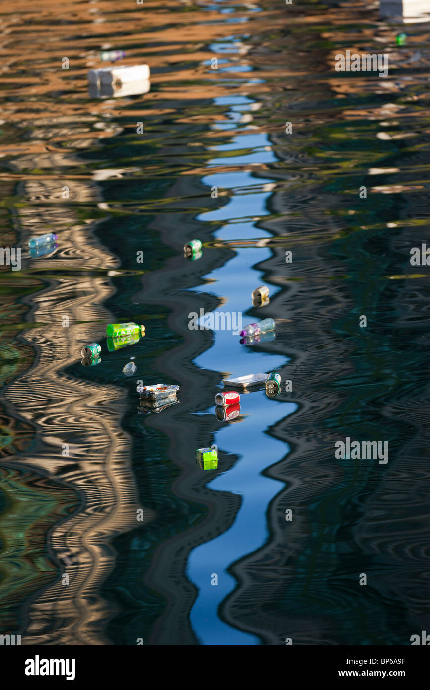 Plastic containers and other debris floating in the water in the Sai ...