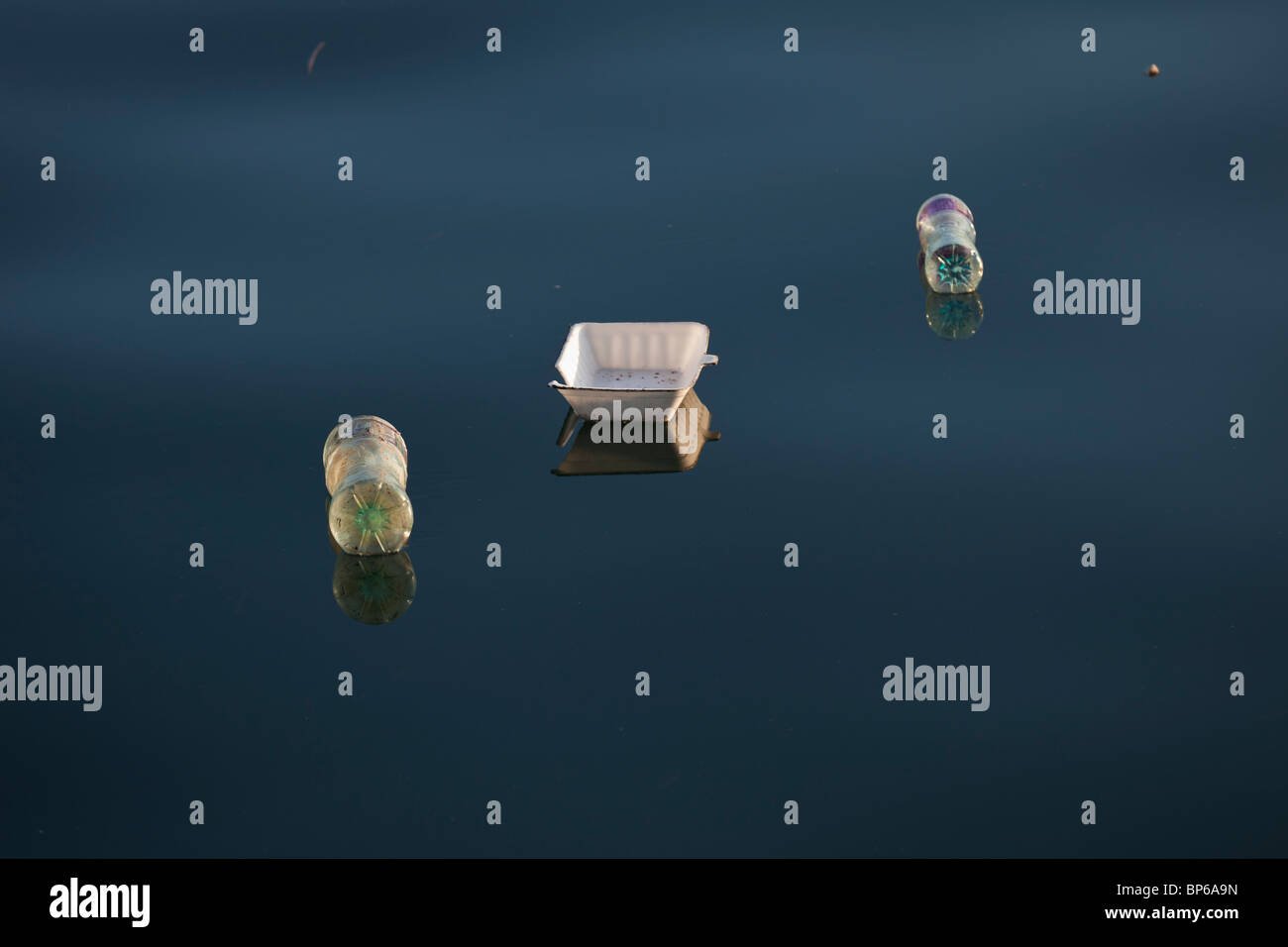 Plastic containers and other debris floating in the water in the Sai ...