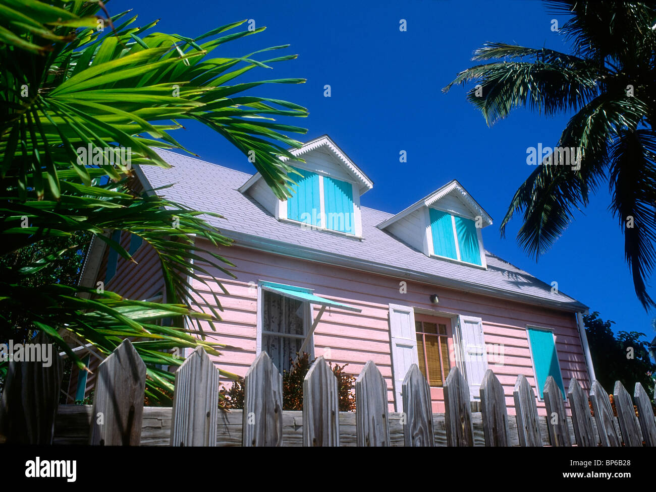 Bahamas pink and blue house Stock Photo - Alamy