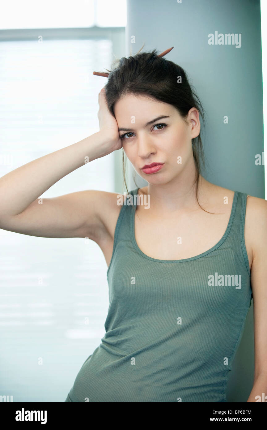 Portrait of a woman looking sad Stock Photo - Alamy