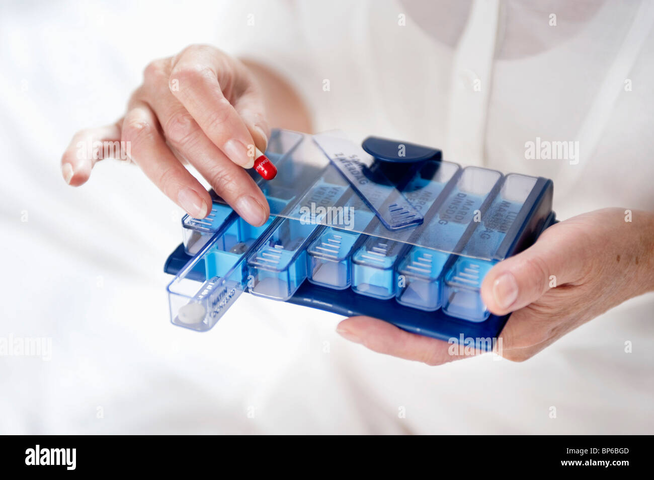 Woman taking a capsule Stock Photo - Alamy