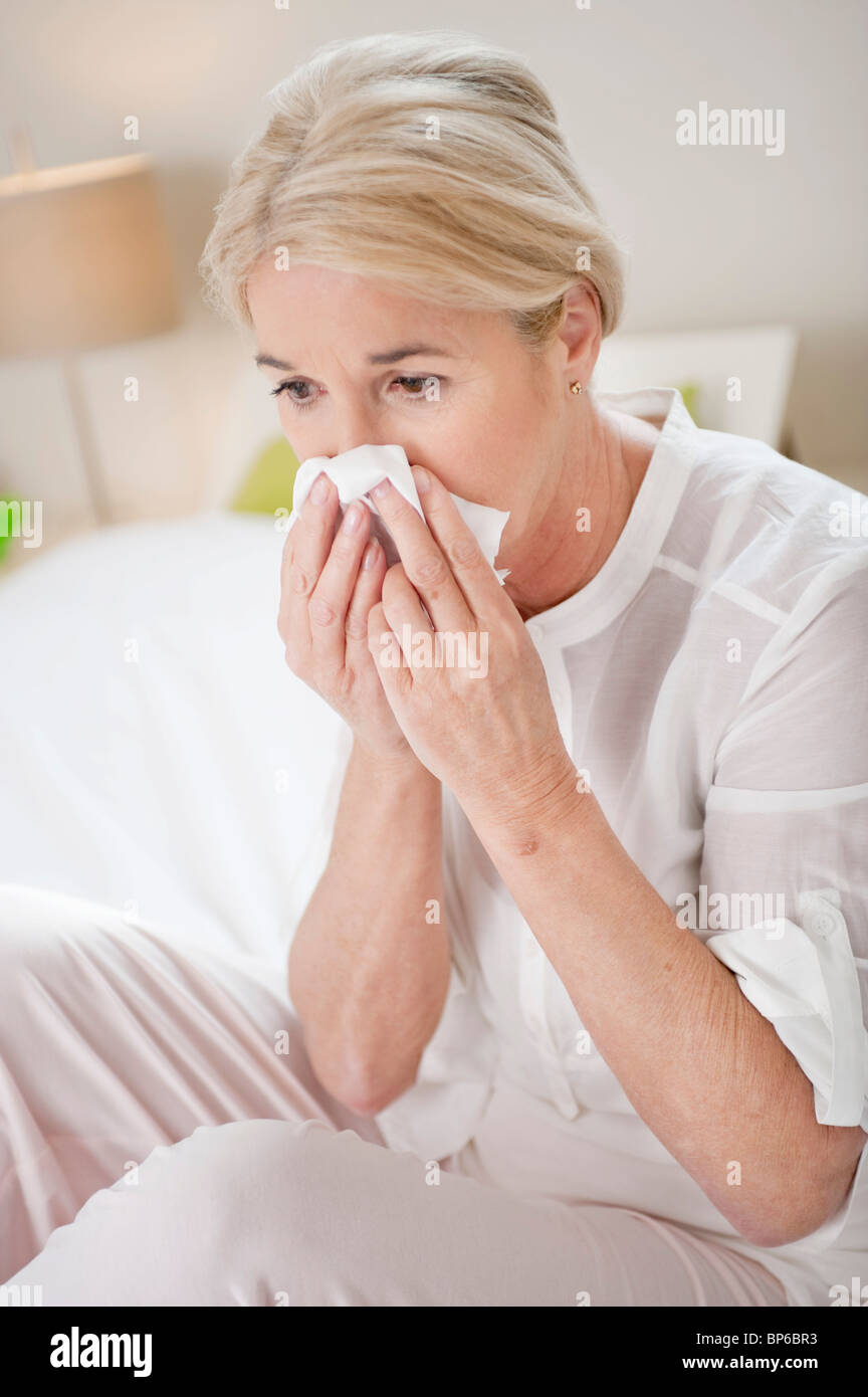 Close-up of a woman suffering from cold Stock Photo - Alamy