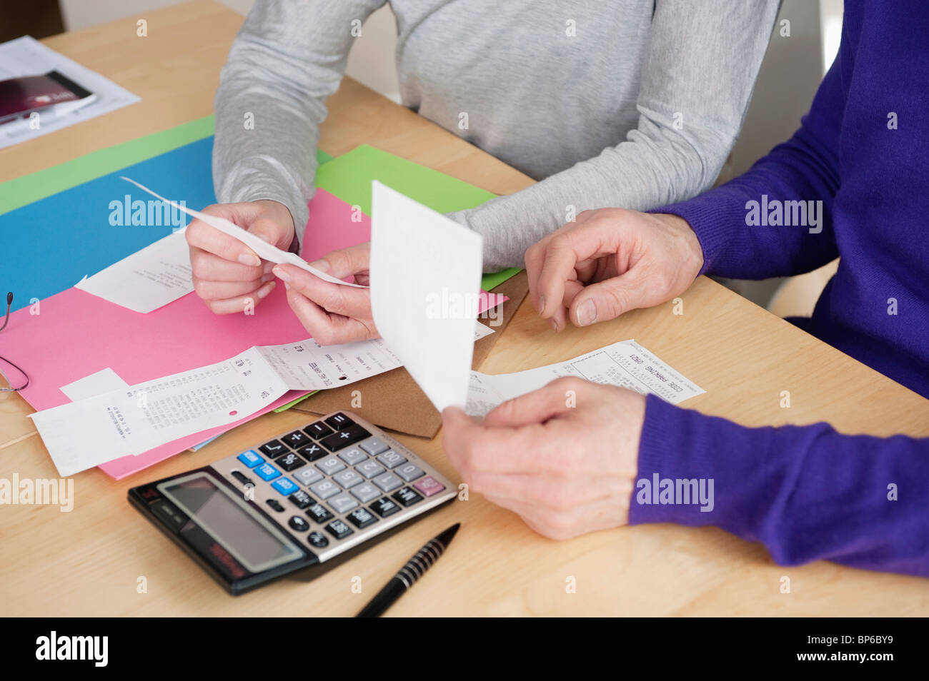 Couple sorting out bills Stock Photo - Alamy