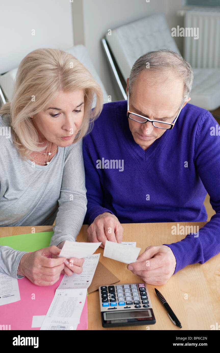 Couple sorting out bills Stock Photo - Alamy