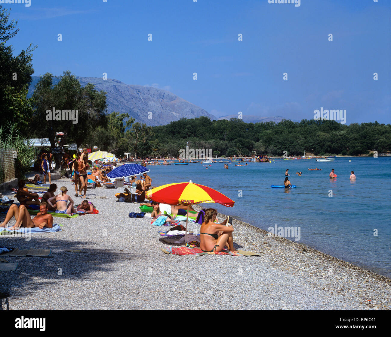 Beach scene at the popular resort of Dassia on the northeast coast of ...