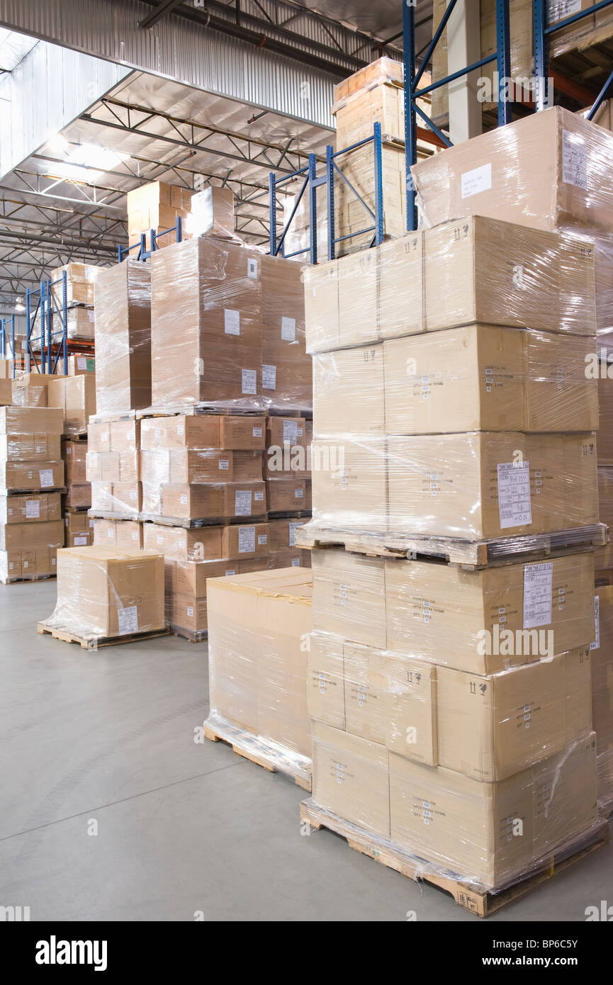 Cardboard boxes stacked in distribution warehouse Stock Photo - Alamy Cardboard boxes stacked in distribution warehouse Stock Photo - Alamy