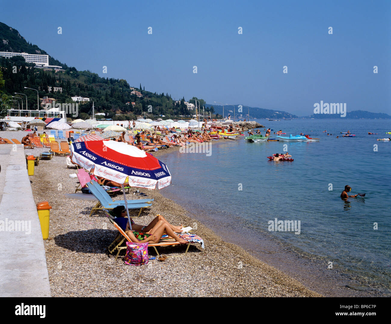 Corfu - Beach scene at the east coast resort of Benitses Stock Photo ...
