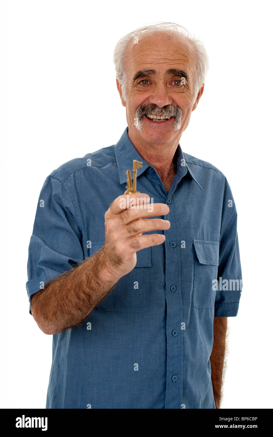 Elderly man holding a set of house keys Stock Photo - Alamy