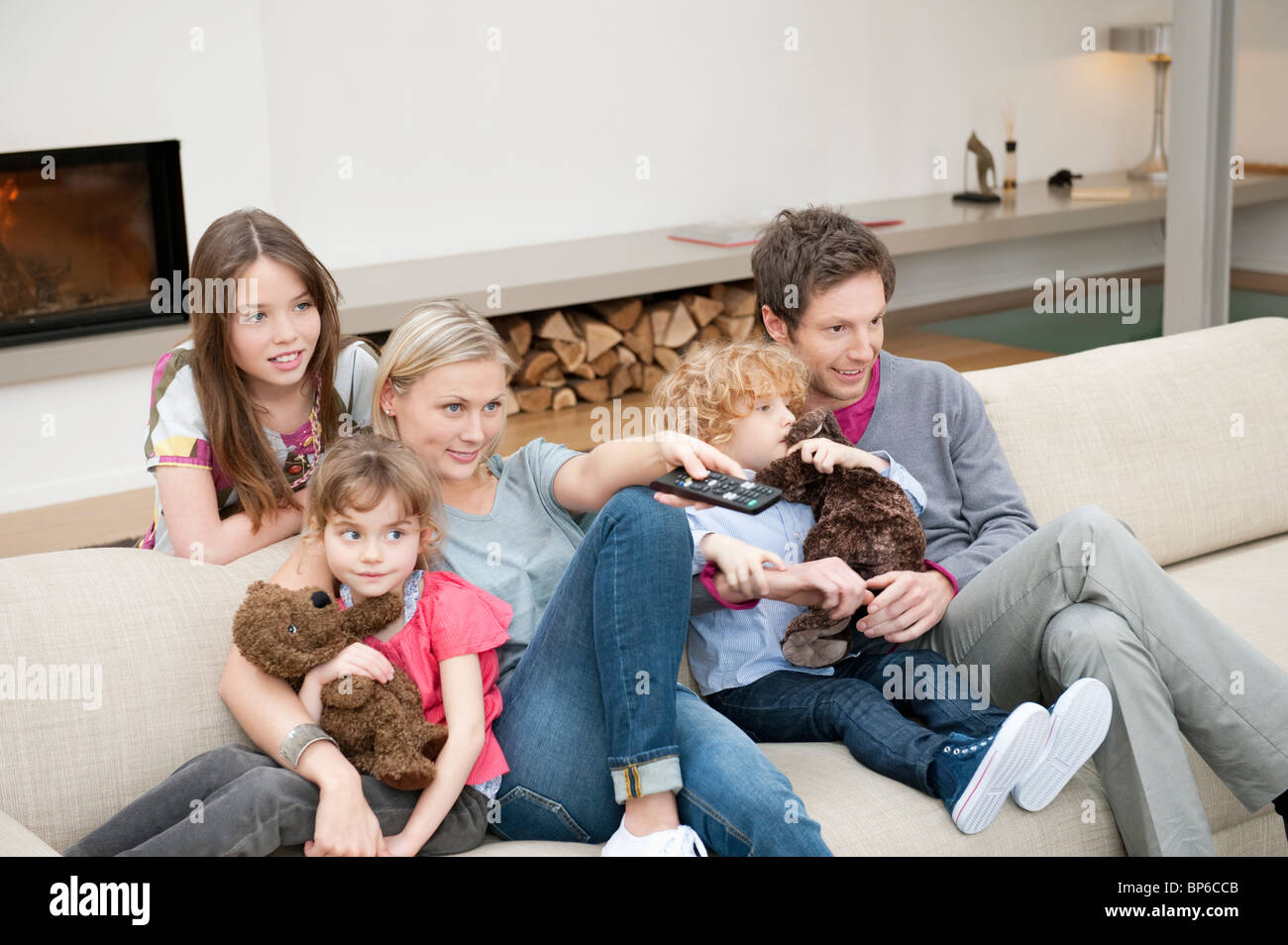 Family watching television Stock Photo - Alamy