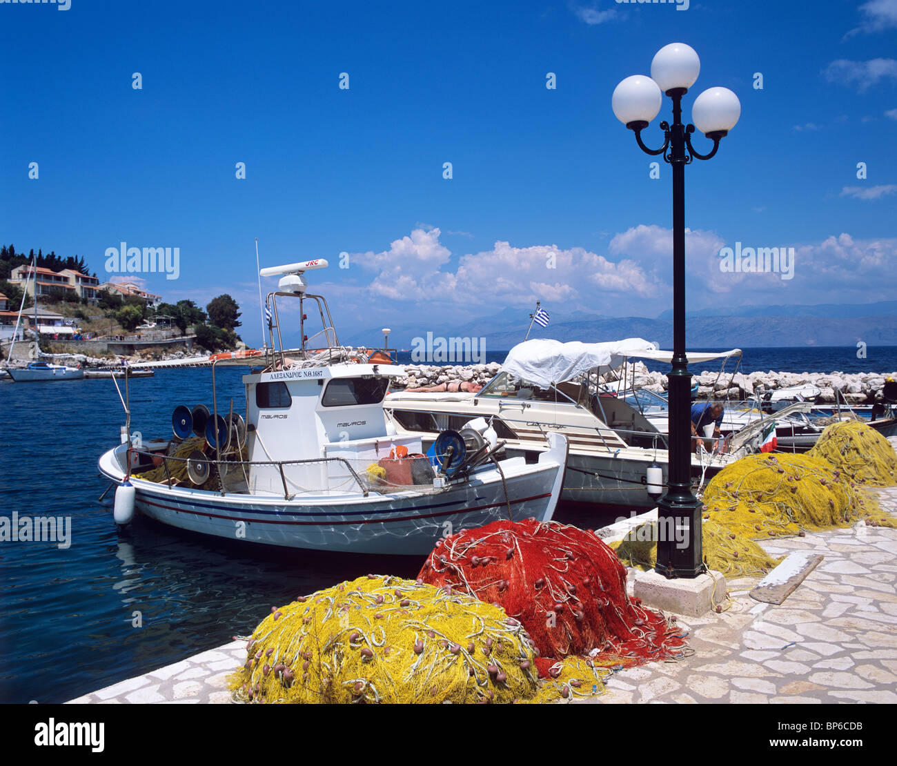 Colourful harbourside scene at the popular resort of Kassiopi on the ...