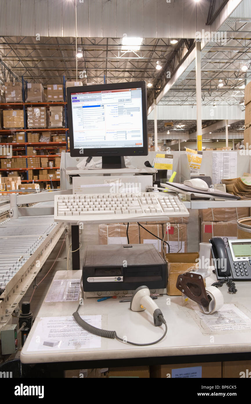 Computer screen in distribution warehouse Stock Photo - Alamy
