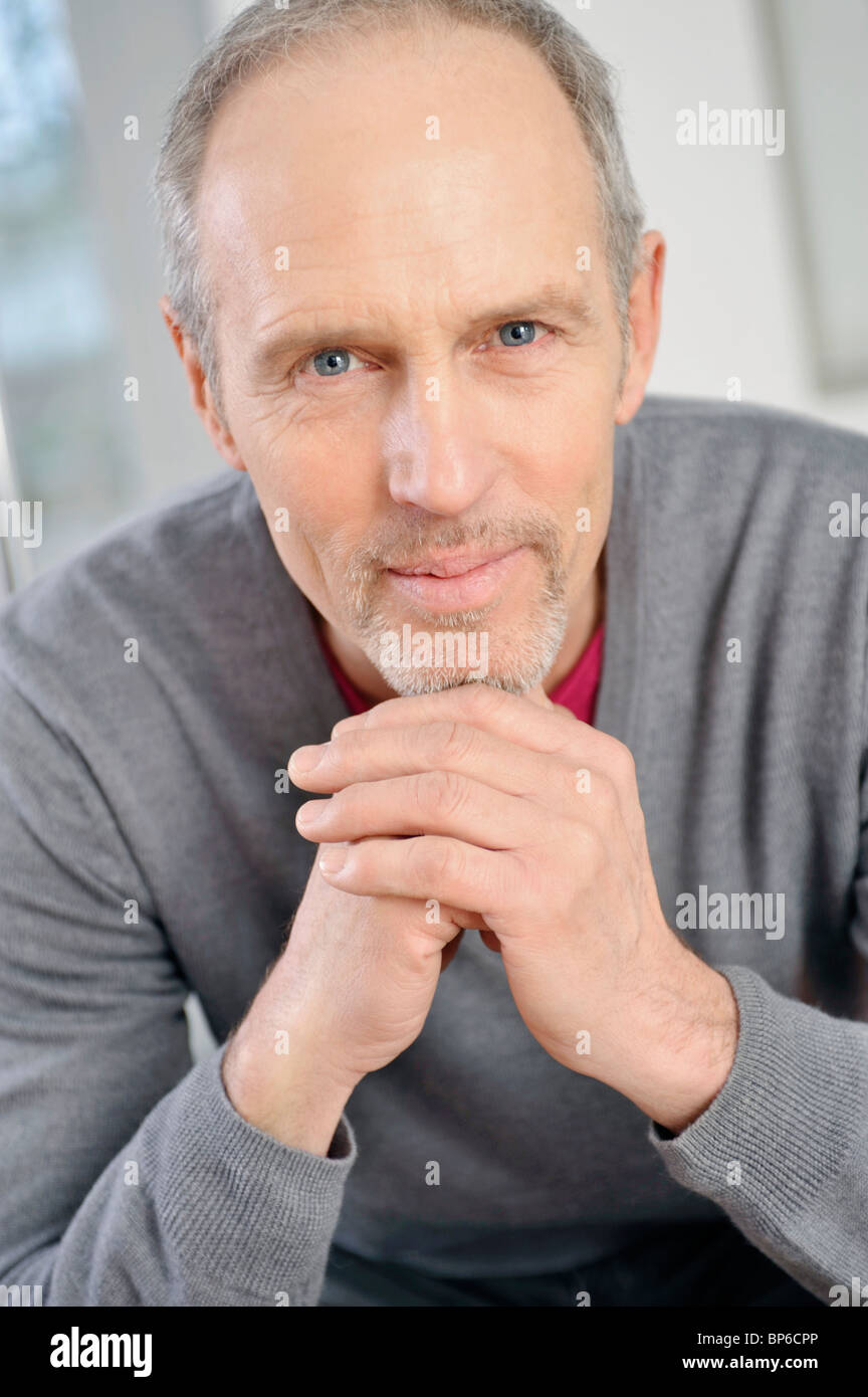 Portrait of a man smirking Stock Photo - Alamy