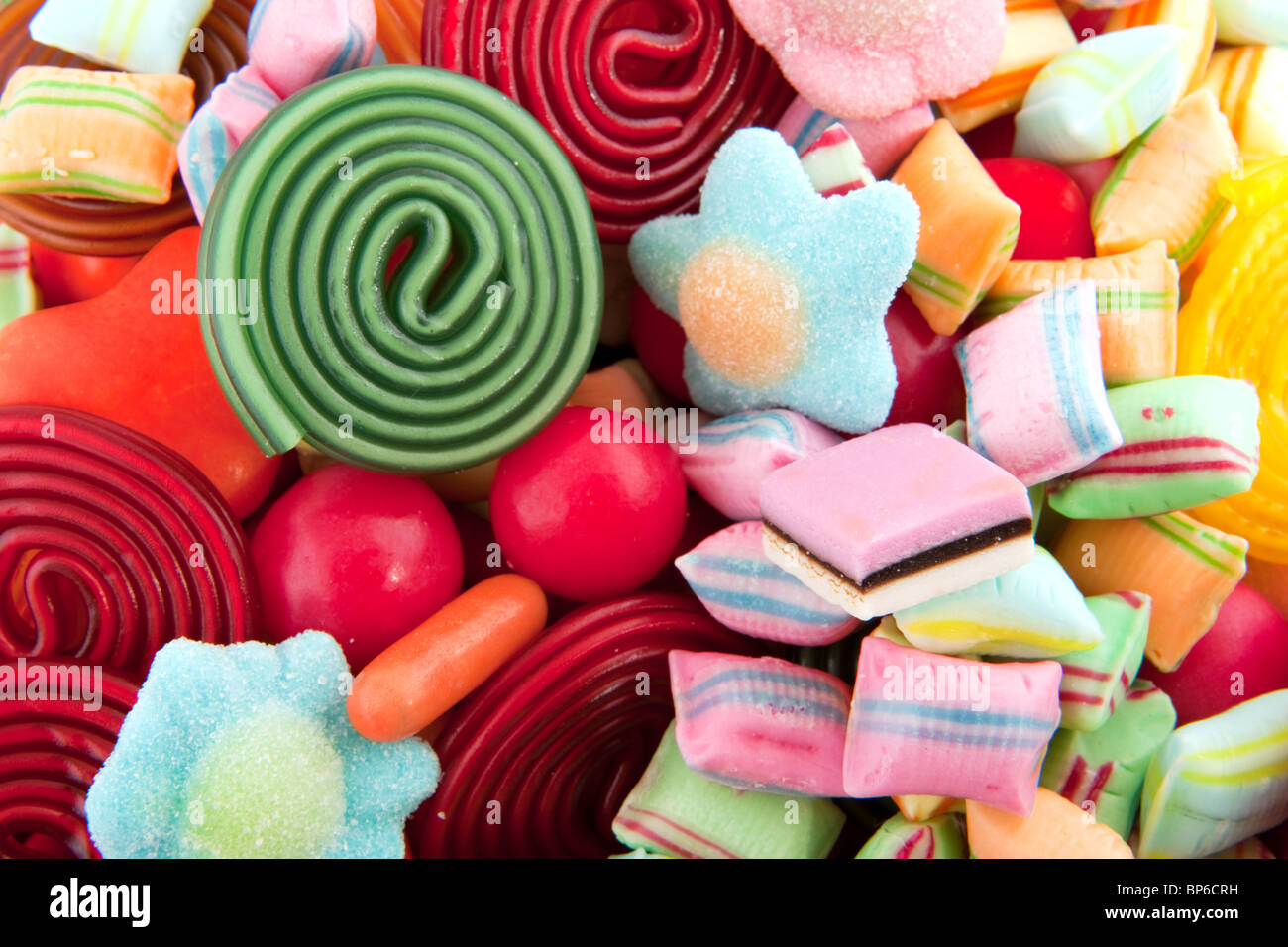 Many colorful candy sweets with rolls balls and pillows Stock Photo - Alamy