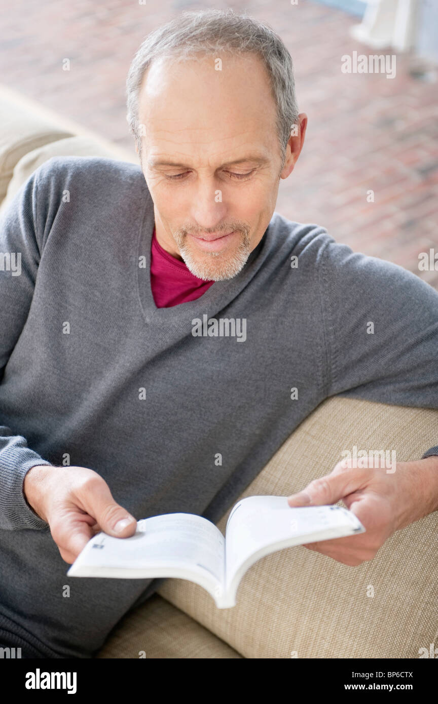 Man reading a book Stock Photo - Alamy