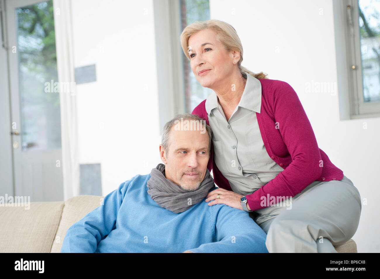 Couple sitting together Stock Photo - Alamy