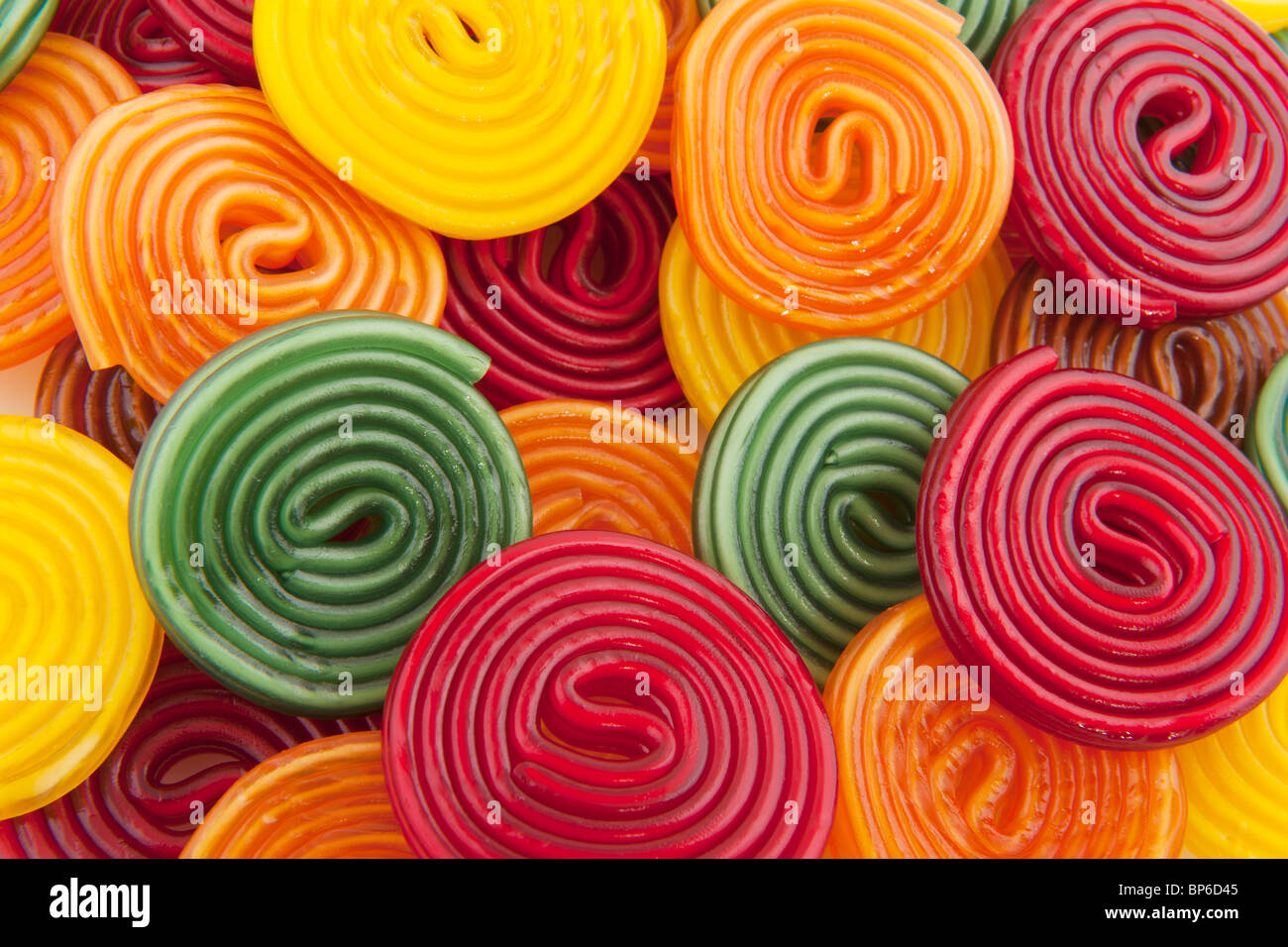 colorful licorice candy drop rolls as background Stock Photo - Alamy