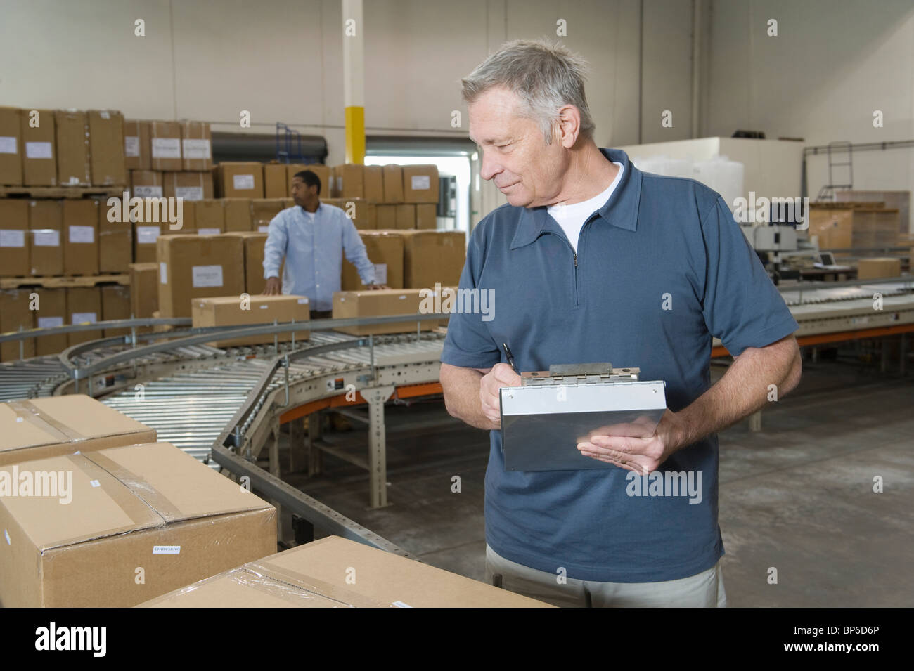 Man working in distribution warehouse Stock Photo - Alamy