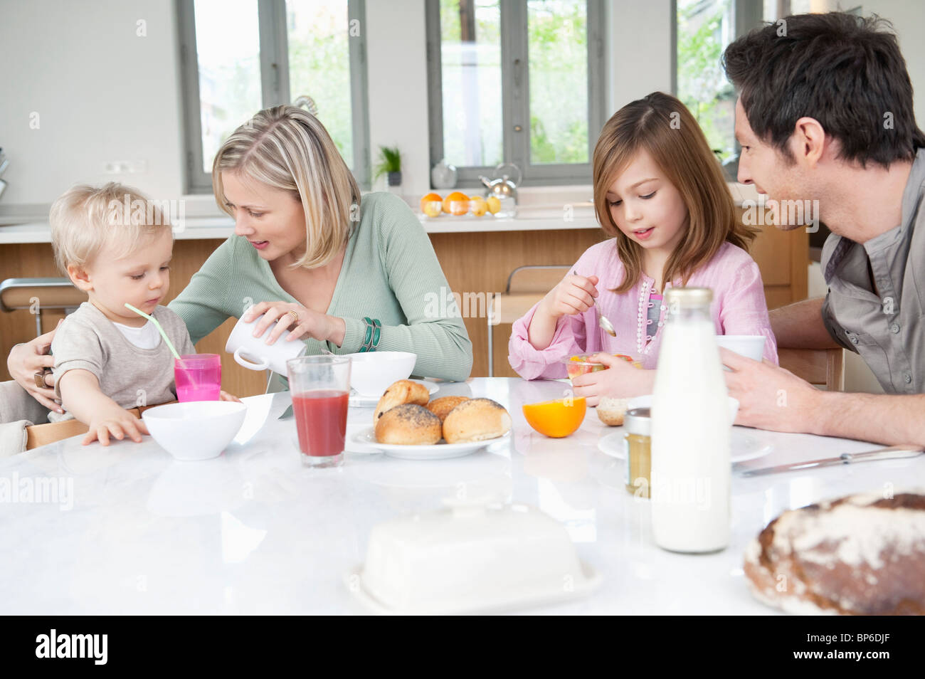 Family at a breakfast table Stock Photo - Alamy