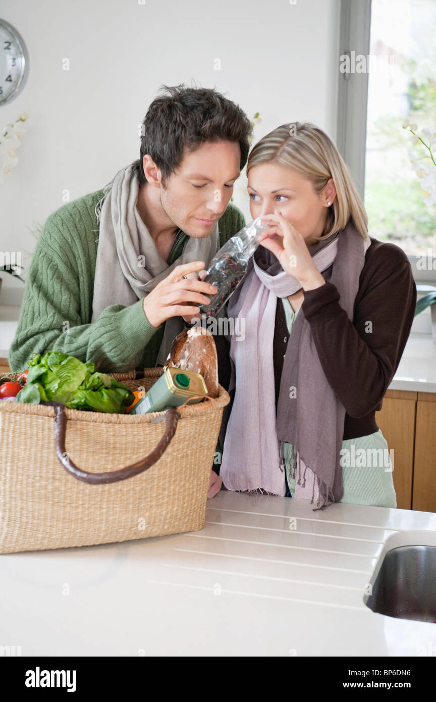Couple smelling food Stock Photo - Alamy