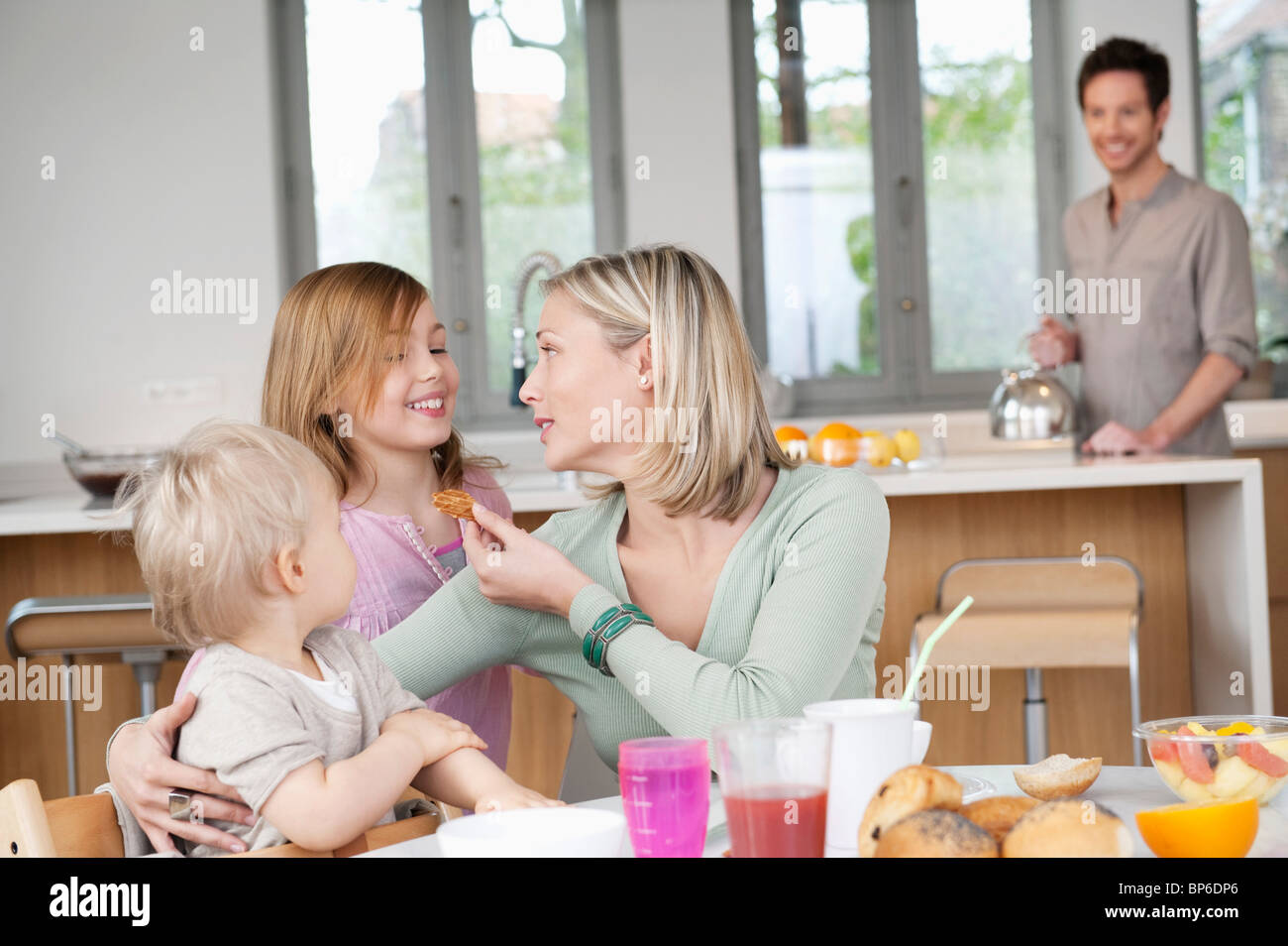 Family at a breakfast table Stock Photo - Alamy