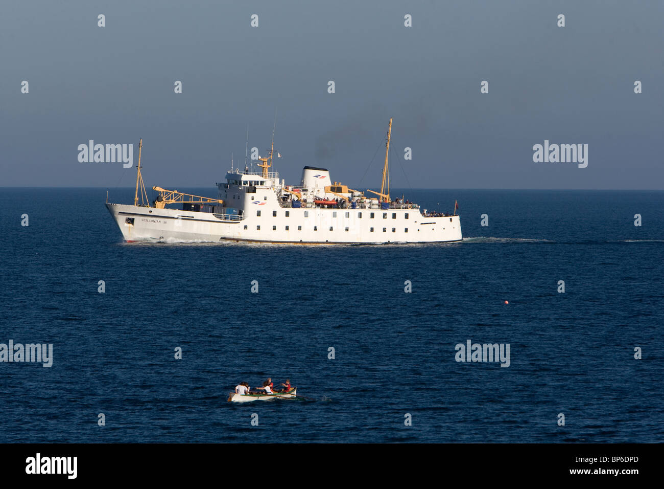 The Scillonian 111 passenger ferry passes a gig on the way from The ...