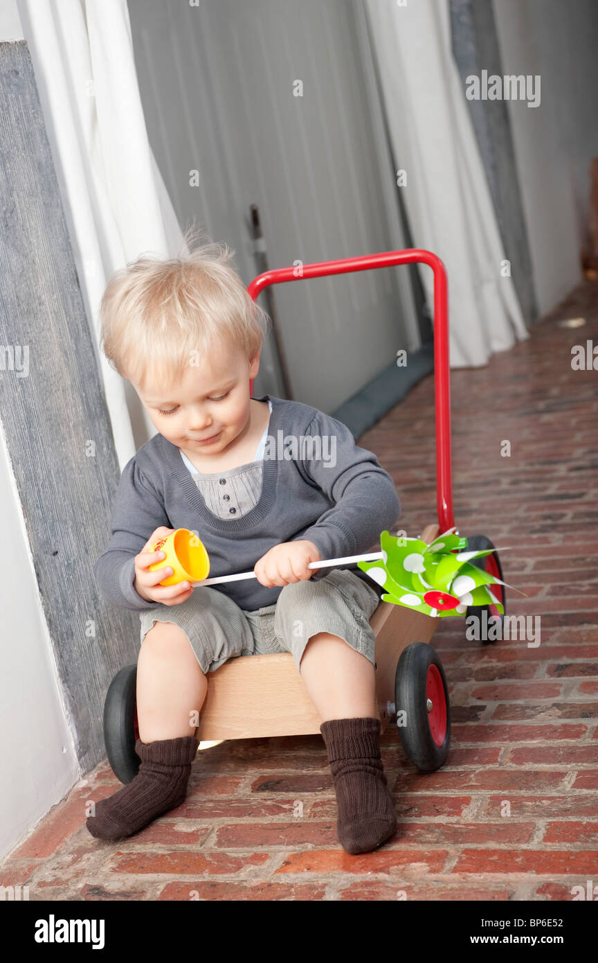 Boy playing with a pinwheel Stock Photo - Alamy