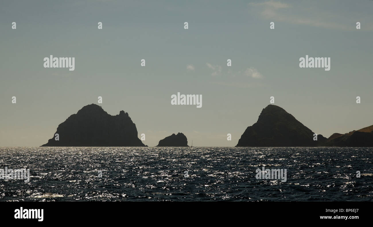 Jagged rocks raising out of the ocean Stock Photo - Alamy