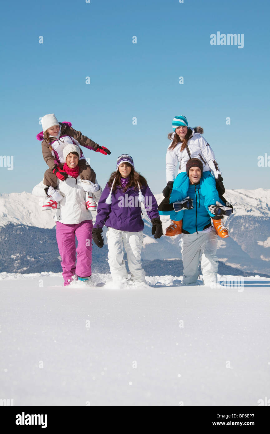Happy family in snow Stock Photo - Alamy