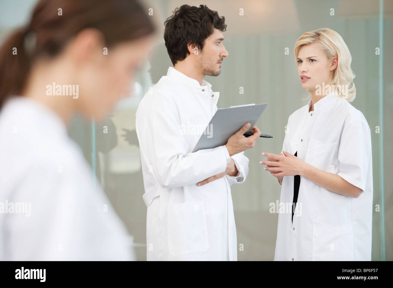 Two doctors discussing each other Stock Photo - Alamy