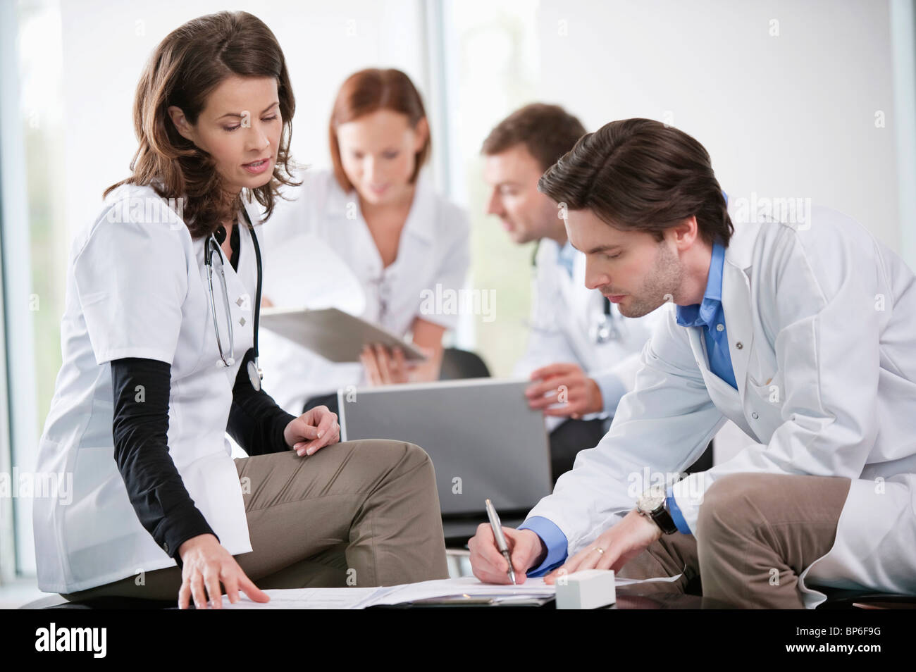 Doctors discussing together Stock Photo - Alamy